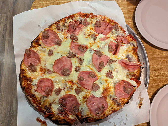 This meat lover's dream showcases Jake's commitment to generous toppings &ndash; no skimping here, just pure pizza satisfaction.