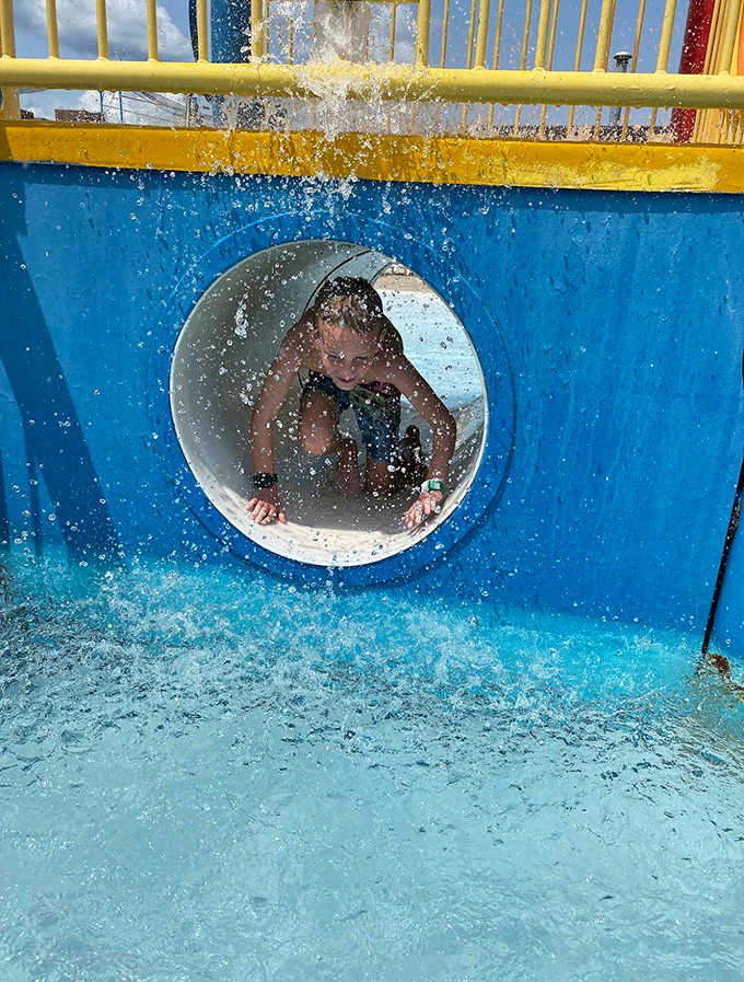 Racing through the enclosed water slide tunnel delivers that perfect combination of speed, screams, and spectacular splashdowns that never gets old.