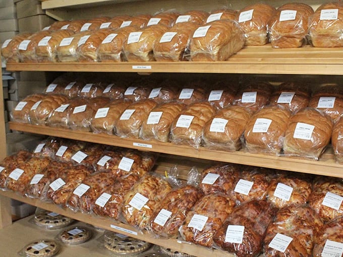 Freshly baked loaves stand at attention like delicious soldiers, while fruit pies below wait patiently to become the highlight of someone's dinner table.
