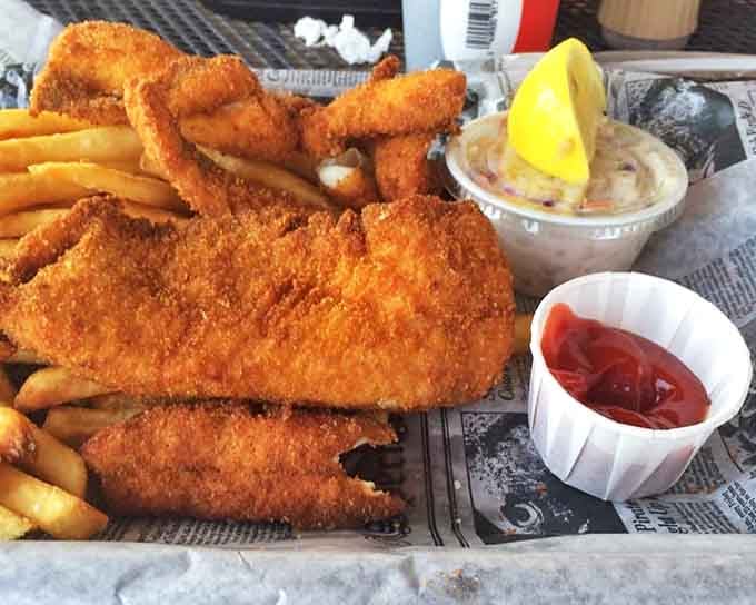 Golden-battered perfection meets paper-lined simplicity. This isn't just fried fish &ndash; it's Lake Superior's finest moment, transformed by heat and skill.