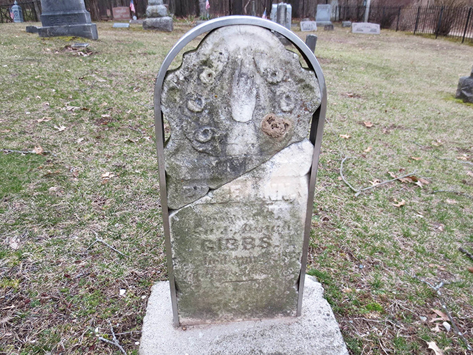 Time and weather have nearly erased this Gibbs family headstone, much like memories of those buried beneath have faded.