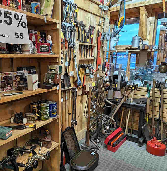 A handyman's paradise of vintage tools lines the walls, each hammer and wrench representing craftsmanship from an era when things were built to last.