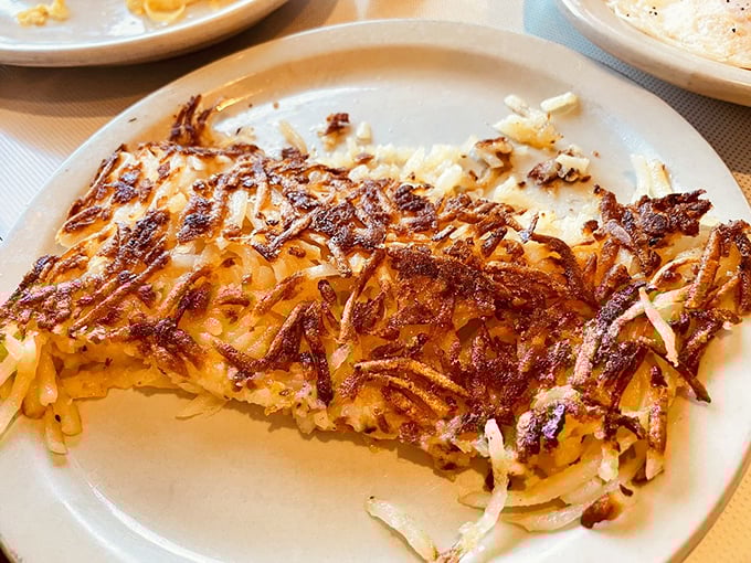 Hash Browns: Golden, crispy perfection that's the true test of any diner's breakfast prowess &ndash; crunchy outside, tender inside, and utterly irresistible.