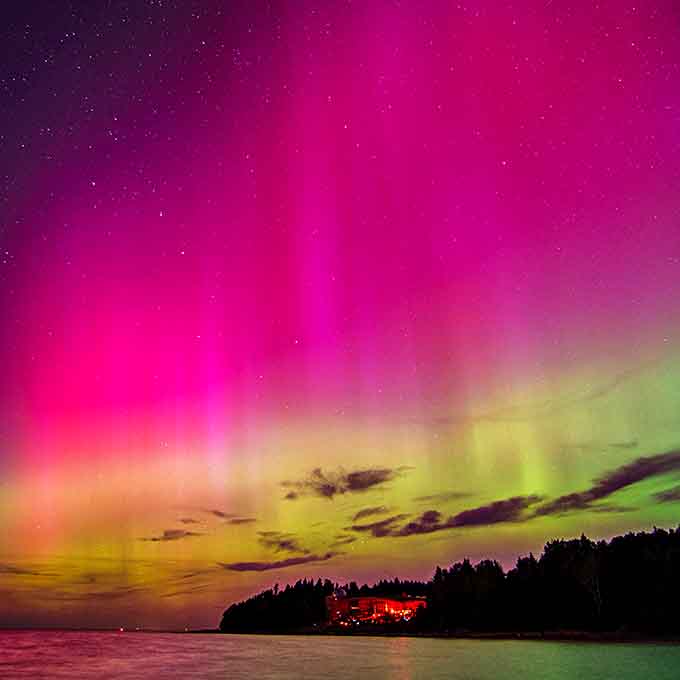 Electric pinks and greens dance across the horizon, proving Mother Nature remains the undisputed champion of light shows.