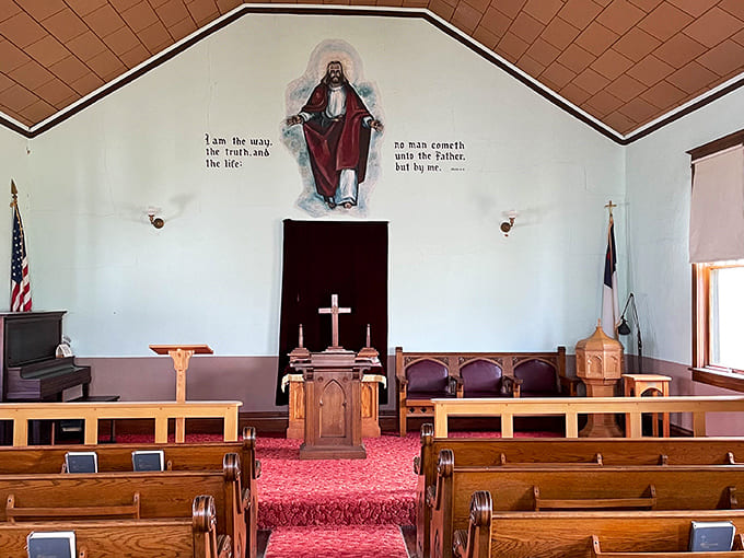 Inside this historic church, wooden pews and sacred artwork create a space where frontier families found comfort during impossibly difficult times.