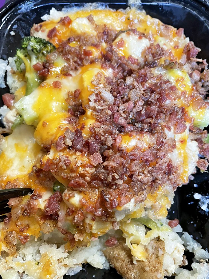 This loaded house potato doesn't just have bacon bits &ndash; it has a bacon explosion, with cheese melting into every nook and cranny.