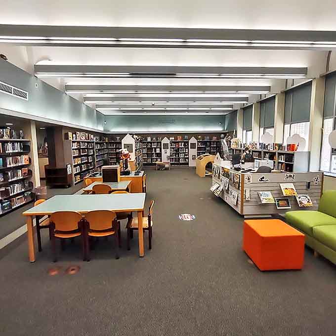 Turquoise hues wash over travelers as they glide through the tunnel, creating an underwater dreamscape that momentarily makes you forget about cramped airplane seats.