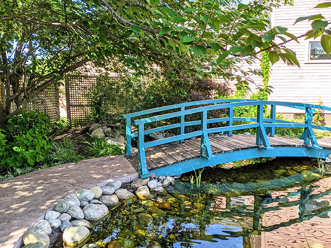 Not just a bridge, but a passage between worlds – this turquoise crossing transforms an ordinary pond into Monet's dream.