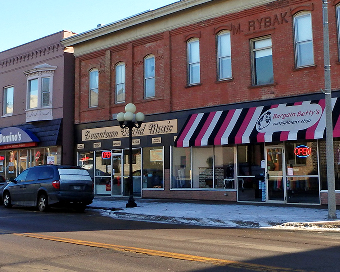 Downtown storefronts maintain their century-old character, where modern businesses thrive behind facades that tell stories of immigrant ambition.