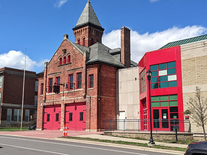 The Michigan Firehouse Museum's bright red doors stand ready, a portal to a time when firefighting required more courage than technology.