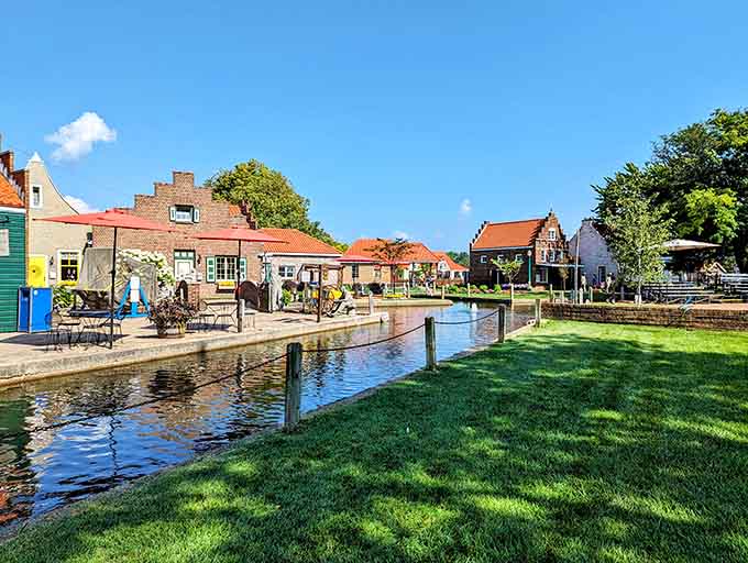 The canal-side village scene looks like someone pressed pause on a European vacation and decided to keep it forever.