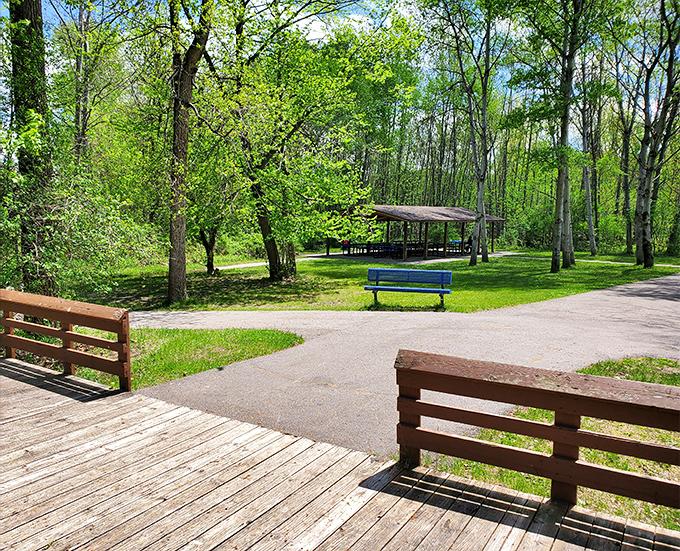 Riverfront Park provides peaceful respite with its wooden benches and shaded pathways, inviting visitors to pause and listen to the river's gentle murmur.