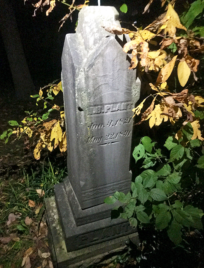 Moonlight creates an ethereal glow on this historic marker, the kind of atmospheric moment when visitors report strange encounters with the past.