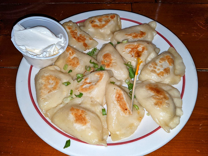 These pierogi aren't just dumplings; they're little pockets of joy with golden-brown exteriors hiding potato and cheese treasures within.