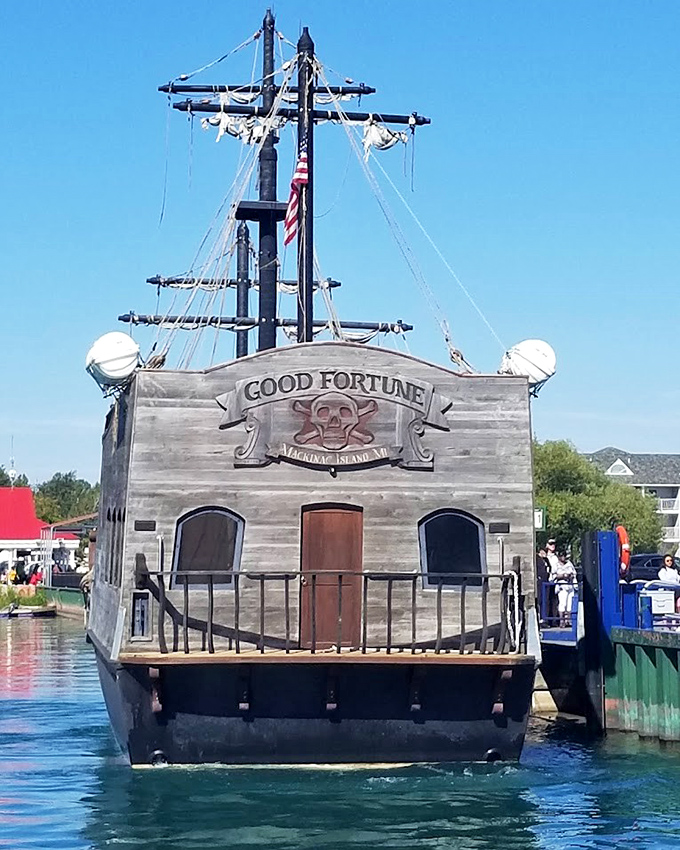 The skull-and-crossbones flag flutters proudly above deck, signaling to all that this isn't your average sightseeing cruise around Mackinac Island.