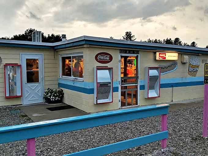 The concession building's cheerful blue trim and classic Coca-Cola signs promise authentic flavors that no multiplex can match.