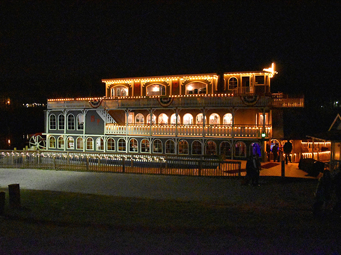 As darkness falls, the Michigan Princess becomes a glowing spectacle on the water, its illuminated decks visible from shore.
