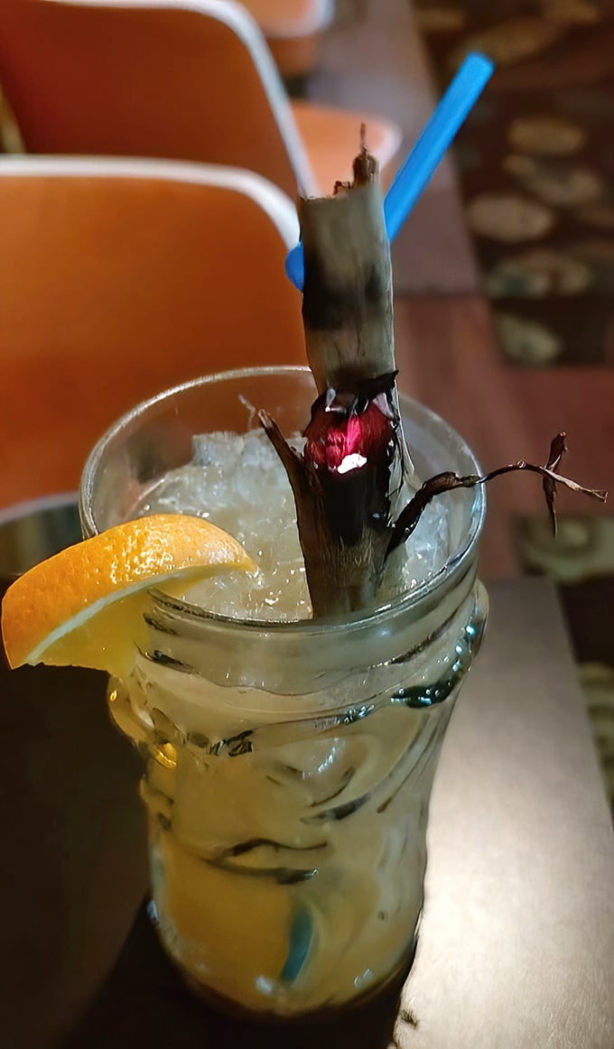 This isn't just a drink; it's a vacation in a glass, complete with bamboo straw and enough tropical flair to banish winter blues.