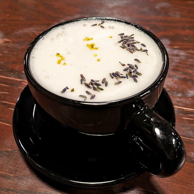A perfectly crafted latte topped with delicate lavender buds &ndash; subtle magic in a cup that tastes as beautiful as it looks.