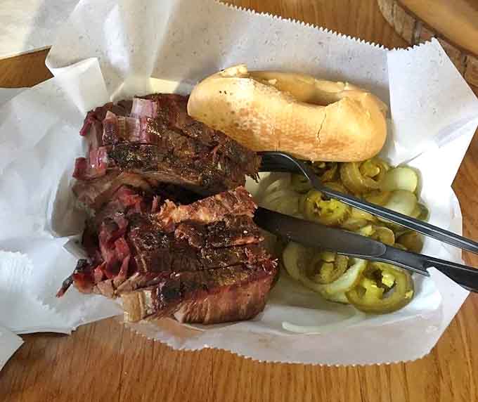 Perfectly sliced brisket reveals that coveted pink smoke ring, with pickled jalape&ntilde;os adding a zingy counterpoint to the rich meat.