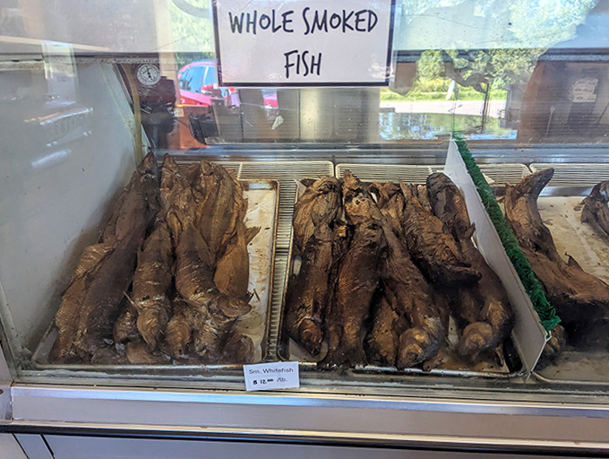 Smoky, golden treasures lined up like edible trophies &ndash; these whole smoked whitefish aren't just food, they're the result of generations of Upper Peninsula know-how.