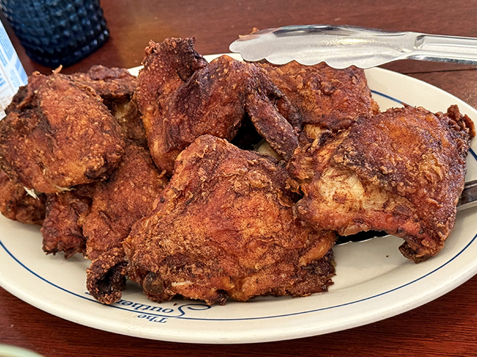 Golden-brown perfection on a plate &ndash; this fried chicken achieves that mythical balance of shatteringly crisp exterior and juicy, flavorful meat.