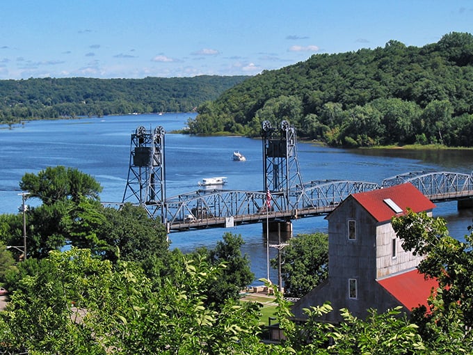 The St. Croix River flows beneath the iconic lift bridge, boats dotting the water like exclamation points in a love letter to summer.