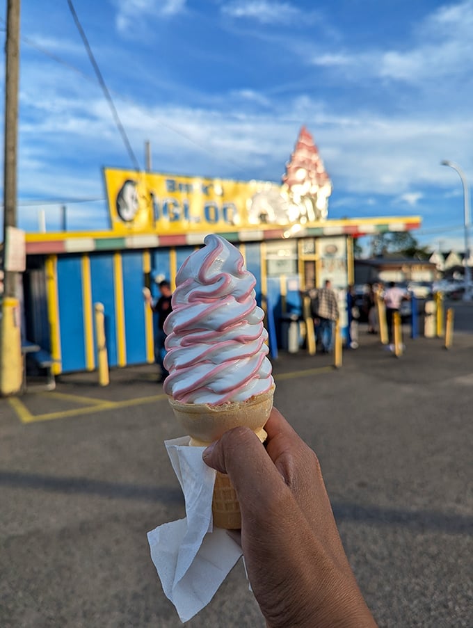 Strawberry soft serve swirled to perfection, catching the golden hour light like an edible work of art.
