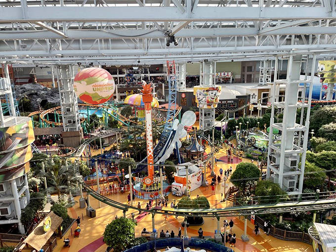 From this dizzying height, the entire technicolor kingdom of Nickelodeon Universe unfolds below, a patchwork of childhood dreams made real.