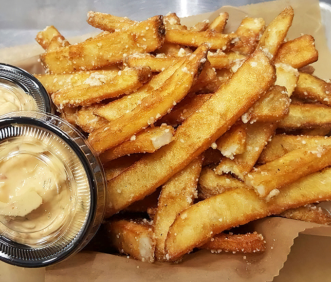 Golden potato perfection dusted with Parmesan and drizzled with truffle oil &ndash; these aren't just fries, they're a religious experience with dipping sauce.