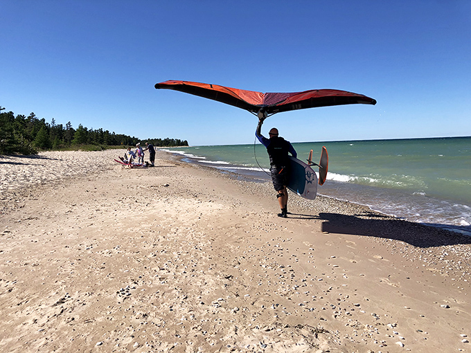 Wind sports enthusiasts have discovered this hidden playground, where Lake Huron's reliable breezes create perfect conditions for aerial adventures.