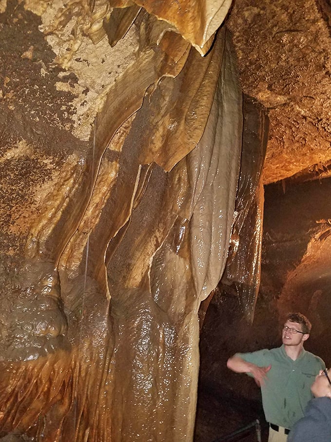 This massive flowstone formation resembles frozen drapery, created one mineral-laden drop at a time over thousands of years.