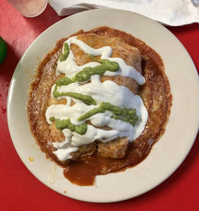 The wet burrito arrives like a present, smothered in sauce so good you'll contemplate drinking what's left on the plate.