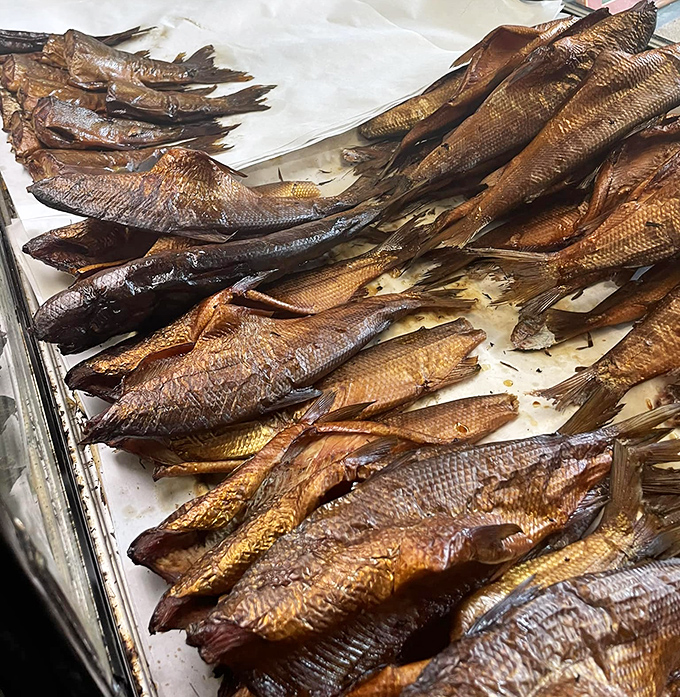 Golden-brown whitefish lined up like edible art, each one a masterpiece of smoke, time, and Great Lakes bounty.