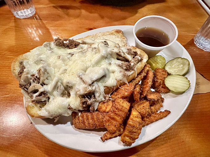 This open-faced sandwich isn't just a meal, it's an engineering marvel of melted cheese and savory goodness.