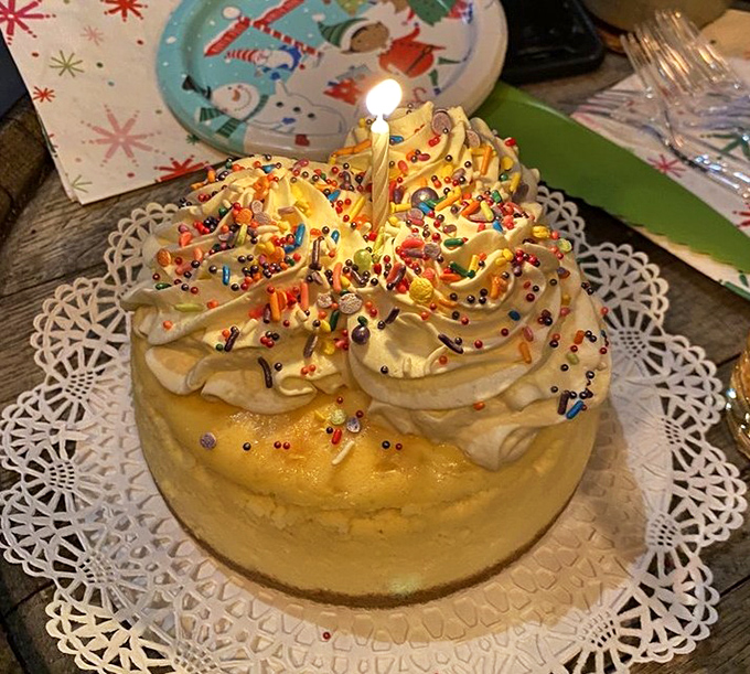 Birthday celebrations reach new heights with this towering vanilla cheesecake, crowned with swirls of cream and festive sprinkles.