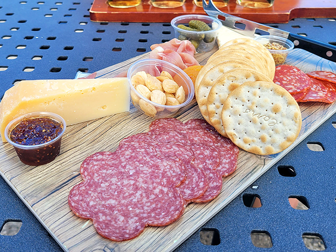A perfectly assembled charcuterie board featuring local cheeses and cured meats – wine's favorite companions on this culinary journey.