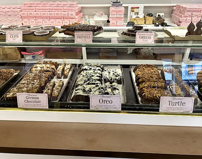 A tempting trifecta of German Chocolate, Oreo, and Turtle fudge varieties awaits behind spotless glass. Diet plans, consider yourselves officially on hold.