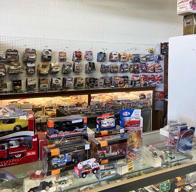 Die-cast model cars gleam in their cases, offering affordable ways to own that dream garage without needing actual garage space or a lottery win.