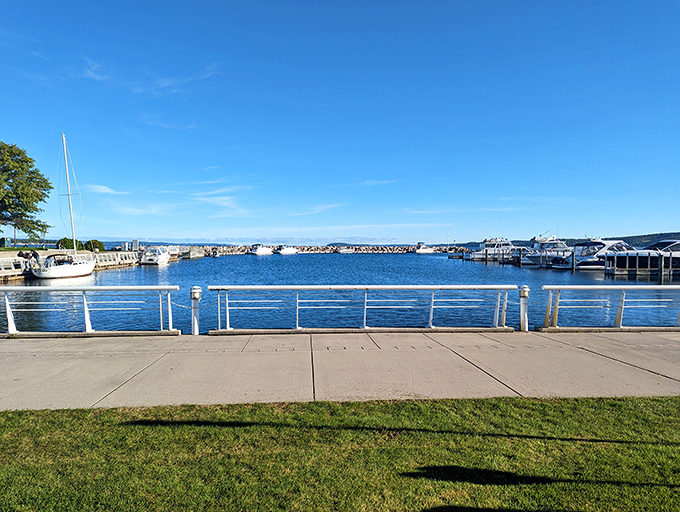 The marina's gentle rhythm of bobbing boats and gleaming water creates a nautical symphony that soothes the soul.