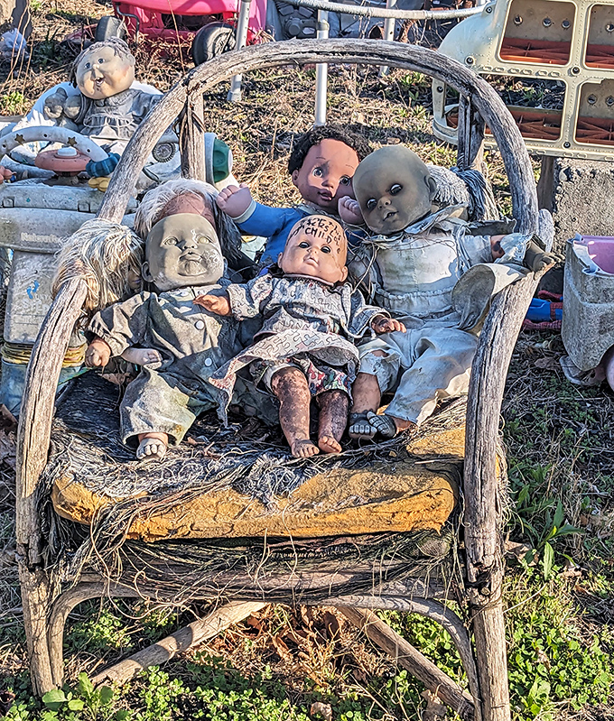 These weathered dolls have seen things. Now they're holding an impromptu therapy session in a vintage chair.
