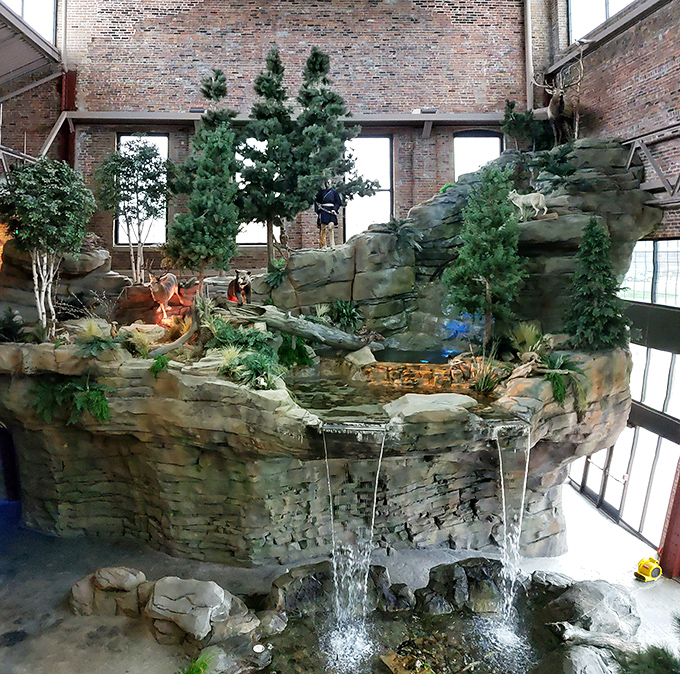 Water cascades over carefully crafted rocks, creating a peaceful soundtrack that makes you forget you're in downtown Detroit rather than the wilderness.