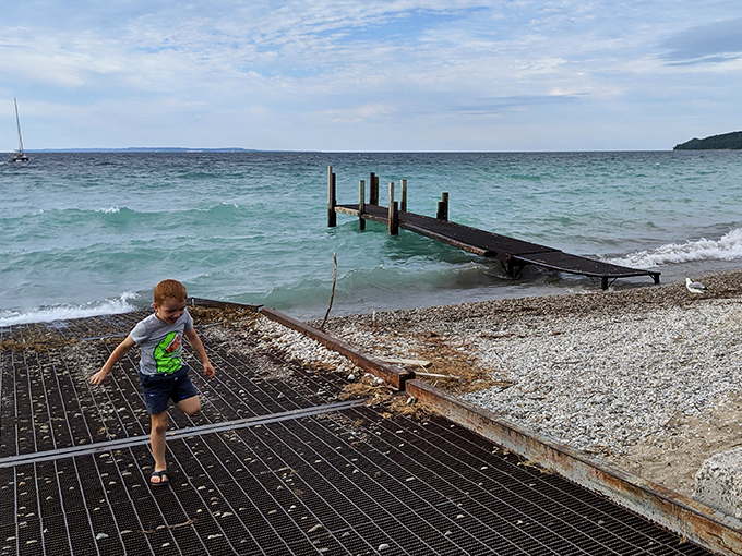 Childhood joy unleashed: where memories are built one sandy footprint at a time on Lake Street's welcoming shores.