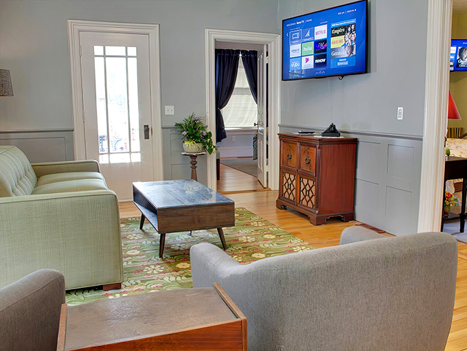 Mid-century modern meets cozy comfort in this living room where conversations flow easier than they do on social media.