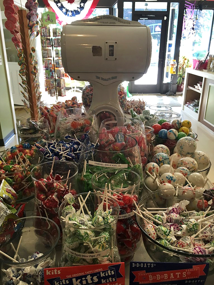 A forest of lollipops stands ready for adoption, each one a swirled galaxy of flavor waiting to be discovered.