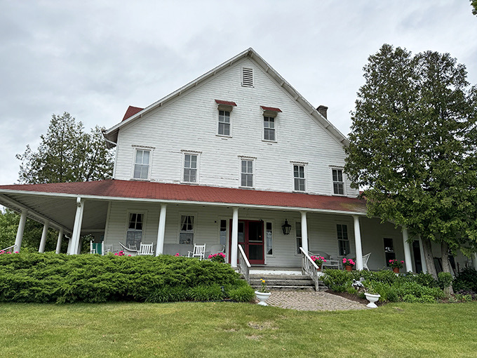 The grand white hotel building stands as a testament to timeless architecture, its wide porch practically demanding you slow down and stay awhile.