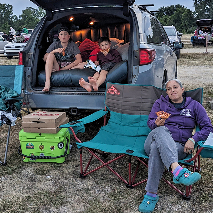 Comfort is king at the drive-in, where families transform their vehicles into cozy nests of blankets, pillows, and prime movie-watching real estate.