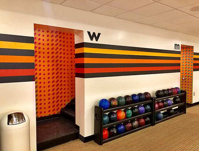 The restroom area bursts with personality &ndash; orange and blue polka dots frame mirrors that make hand-washing an Instagram moment.