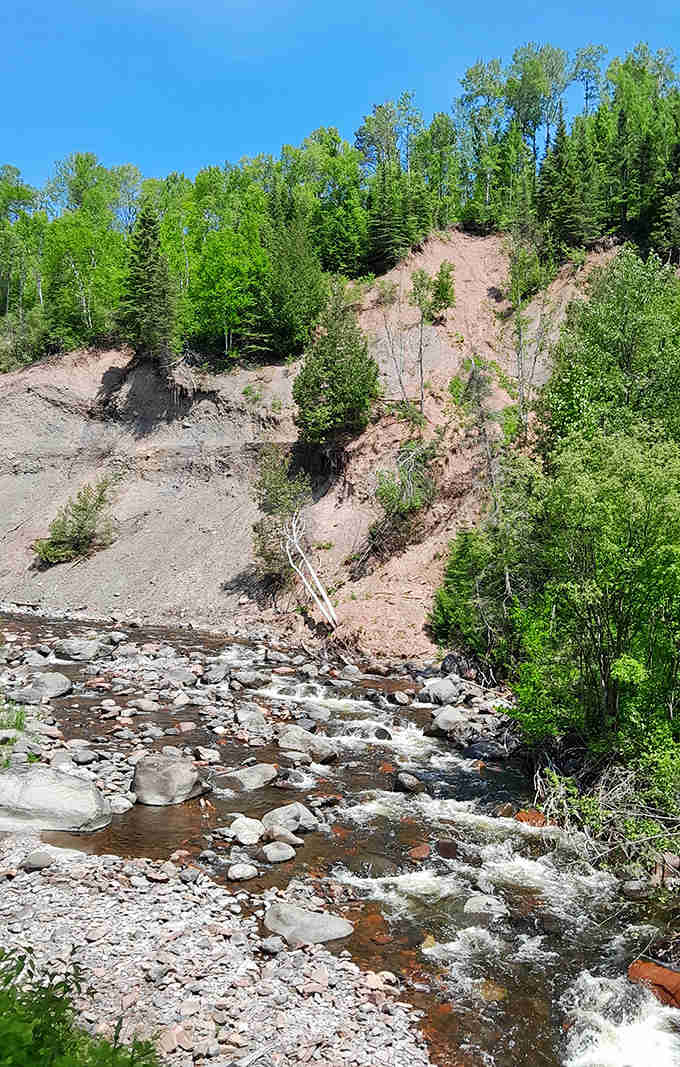 Water dances over billion-year-old stones, creating nature's perfect soundtrack for your wilderness adventure.