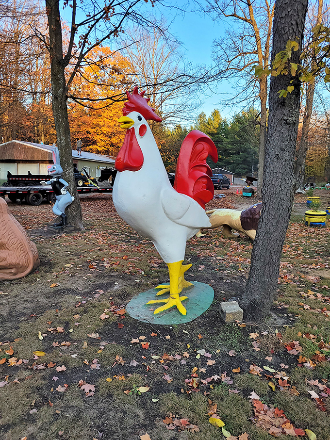 This concrete cock-of-the-walk struts his stuff among autumn leaves, looking ready to announce morning whether you want it or not.